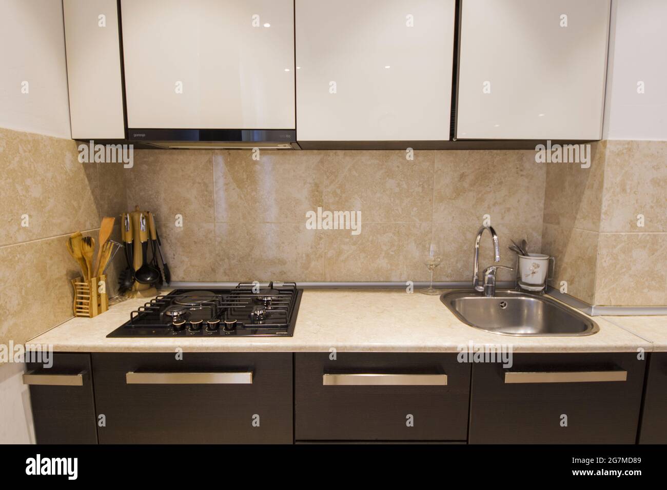 Kitchen interior with a sink and gas cooker Stock Photo - Alamy