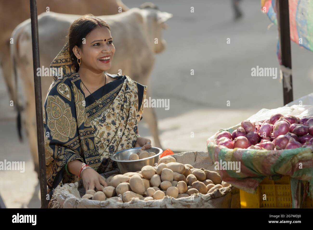 A RURAL WOMAN ENTHUSIASTICALLY BUYING VEGETABLES Stock Photo - Alamy