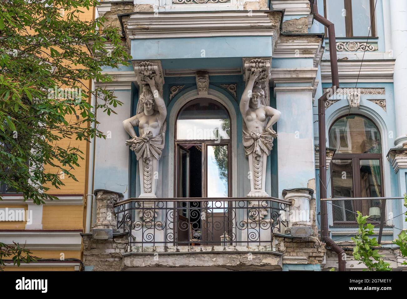 Unique balcony designed with caryatids. Horizontal shot. Unique balcony ...