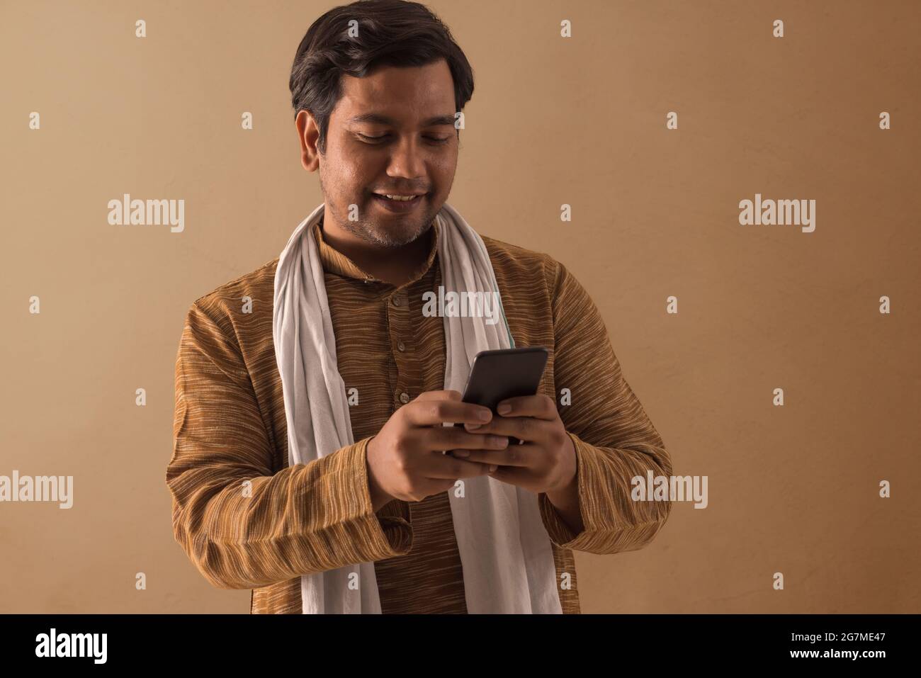 A RURAL MAN HAPPILY USING MOBILE PHONE Stock Photo - Alamy