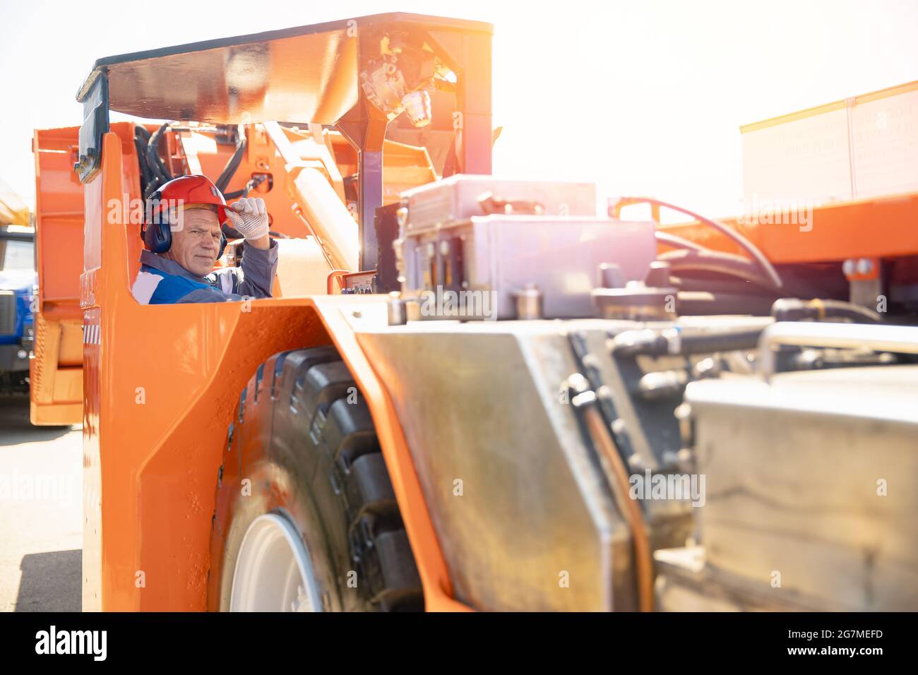 Driver man of construction equipment excavator or tractor. Builder or ...
