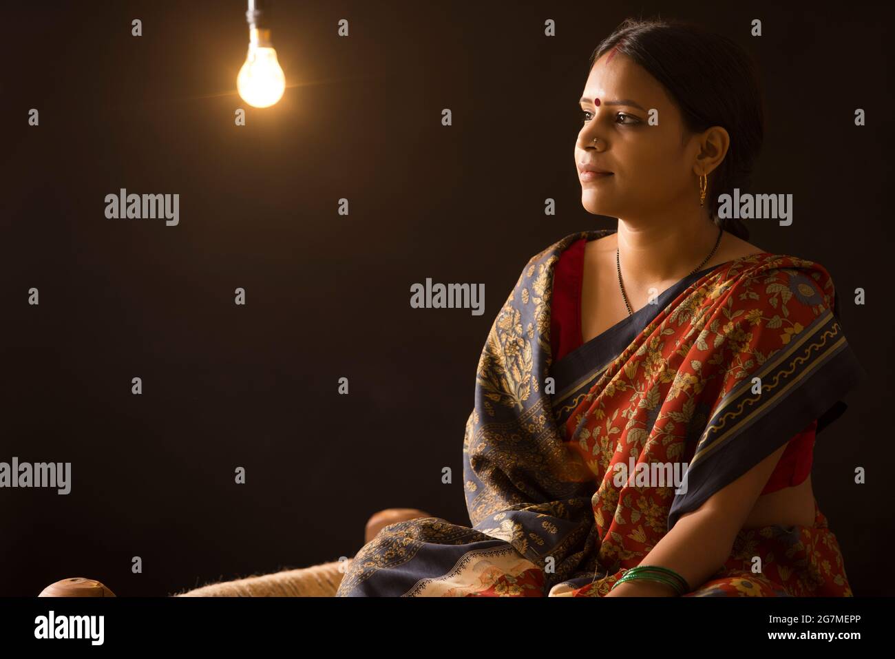 A VILLAGE WOMAN SITTING ALONE AND THINKING Stock Photo - Alamy