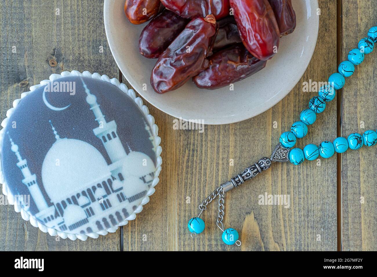 Concept of muslim. Flat lay of rosary near dates and gingerbread with ...