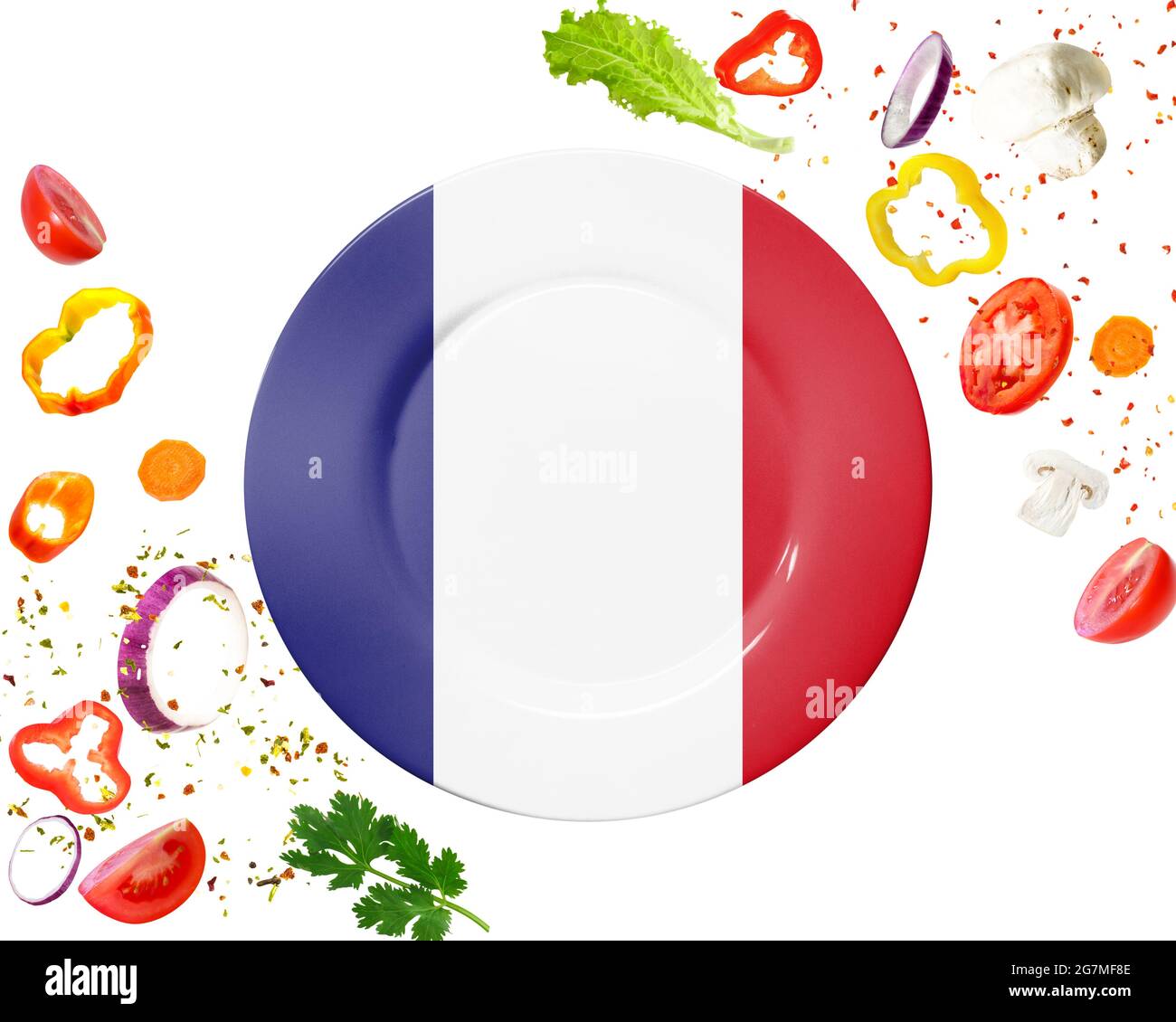 vegetables with painted flag of France on plate isolated on white ...