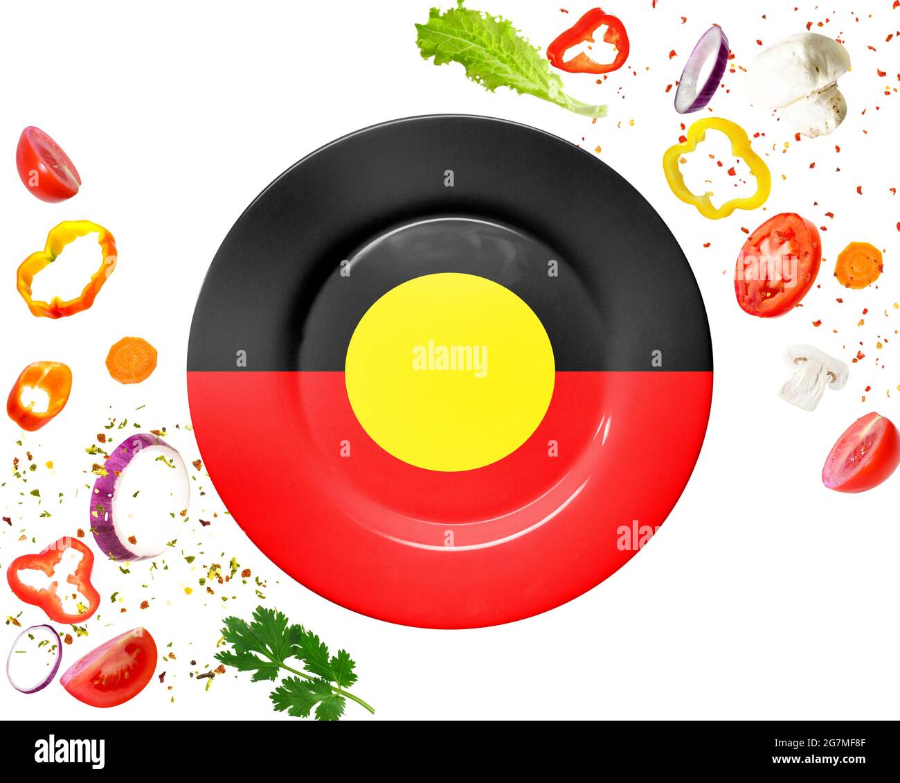 vegetables with painted flag of Australian Aboriginal on plate isolated ...