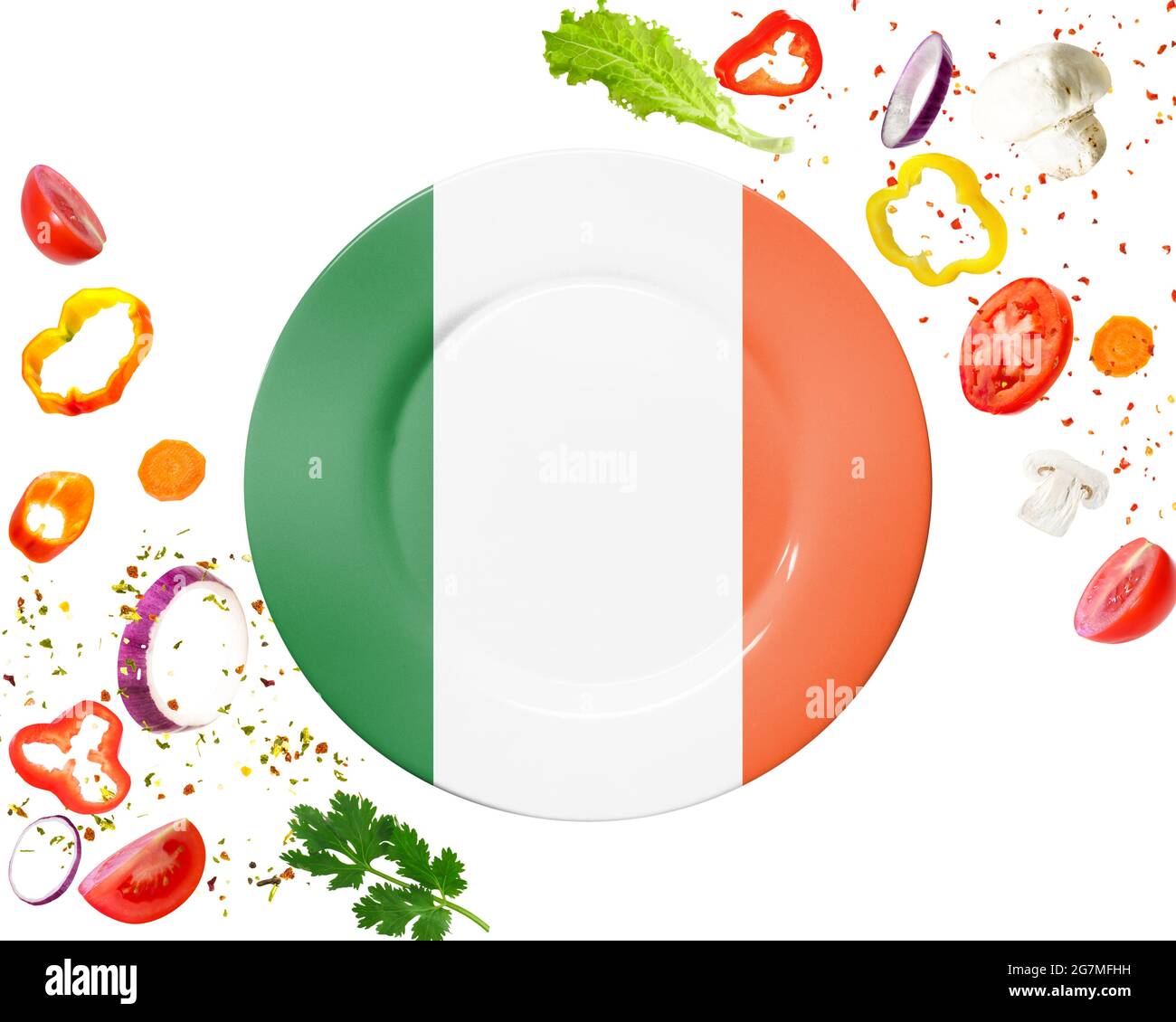 vegetables with painted flag of Ireland on plate isolated on white ...
