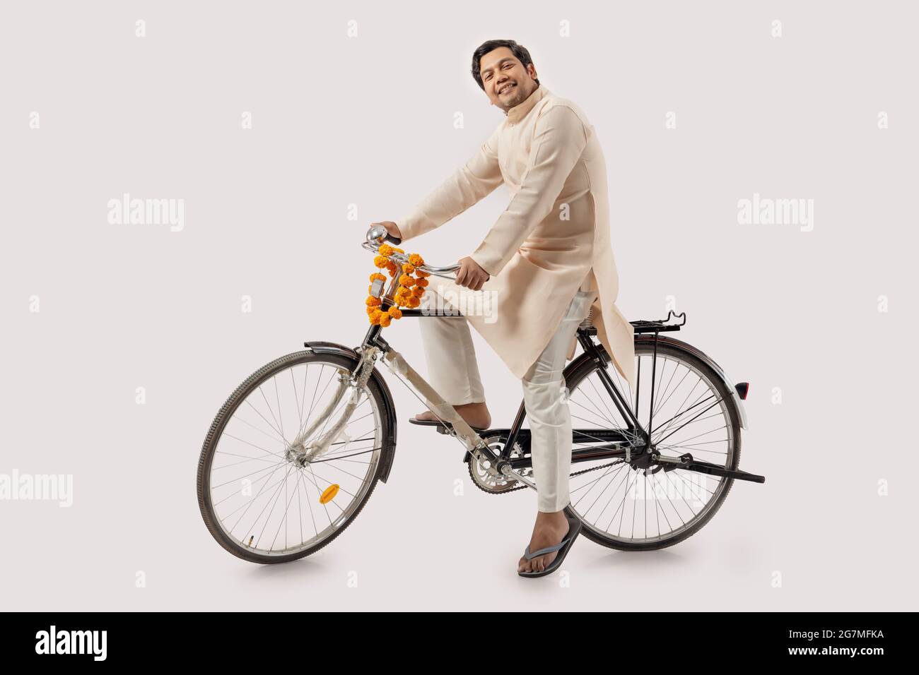 Indian man on bicycle hi-res stock photography and images - Alamy