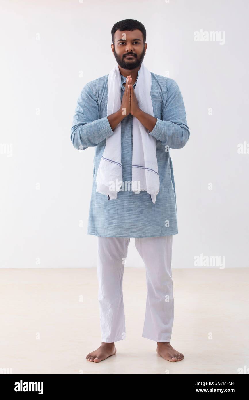 Man standing with hands folded hi-res stock photography and images - Alamy