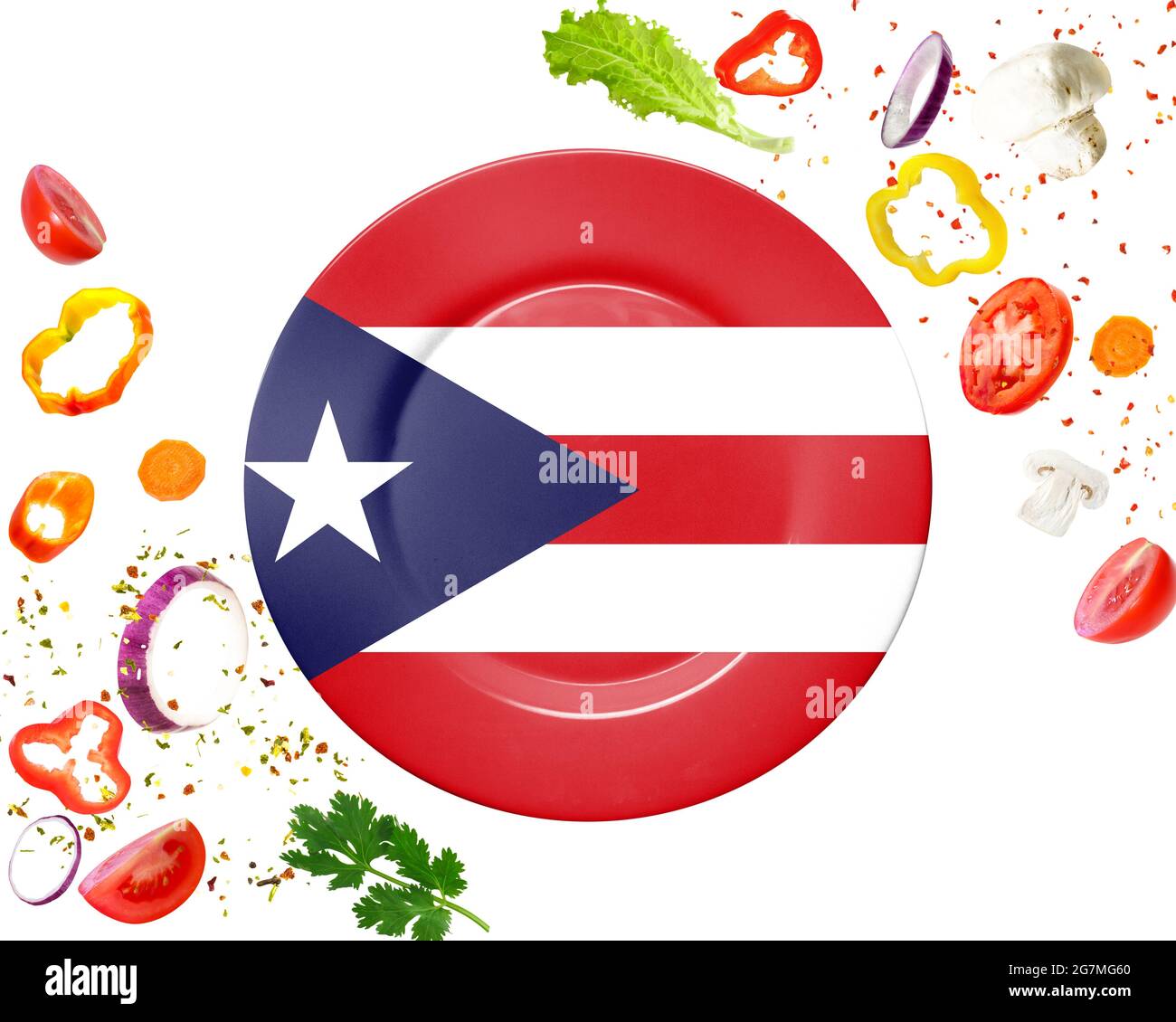 vegetables with painted flag of Puerto Rico on plate isolated on white ...