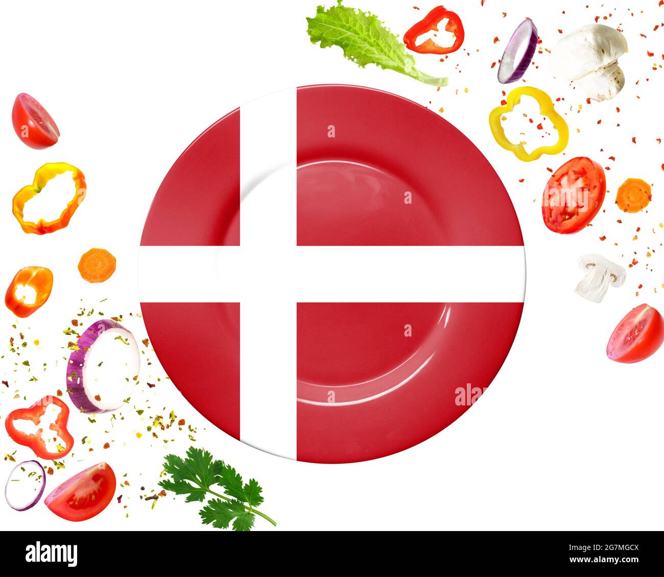 vegetables with painted flag of Denmark on plate isolated on white ...