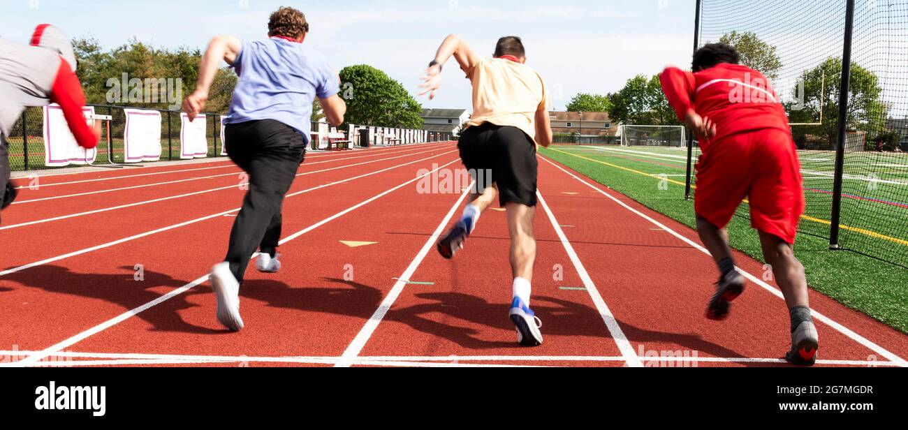 Selective focused used to show the speed of four high school sprint ...