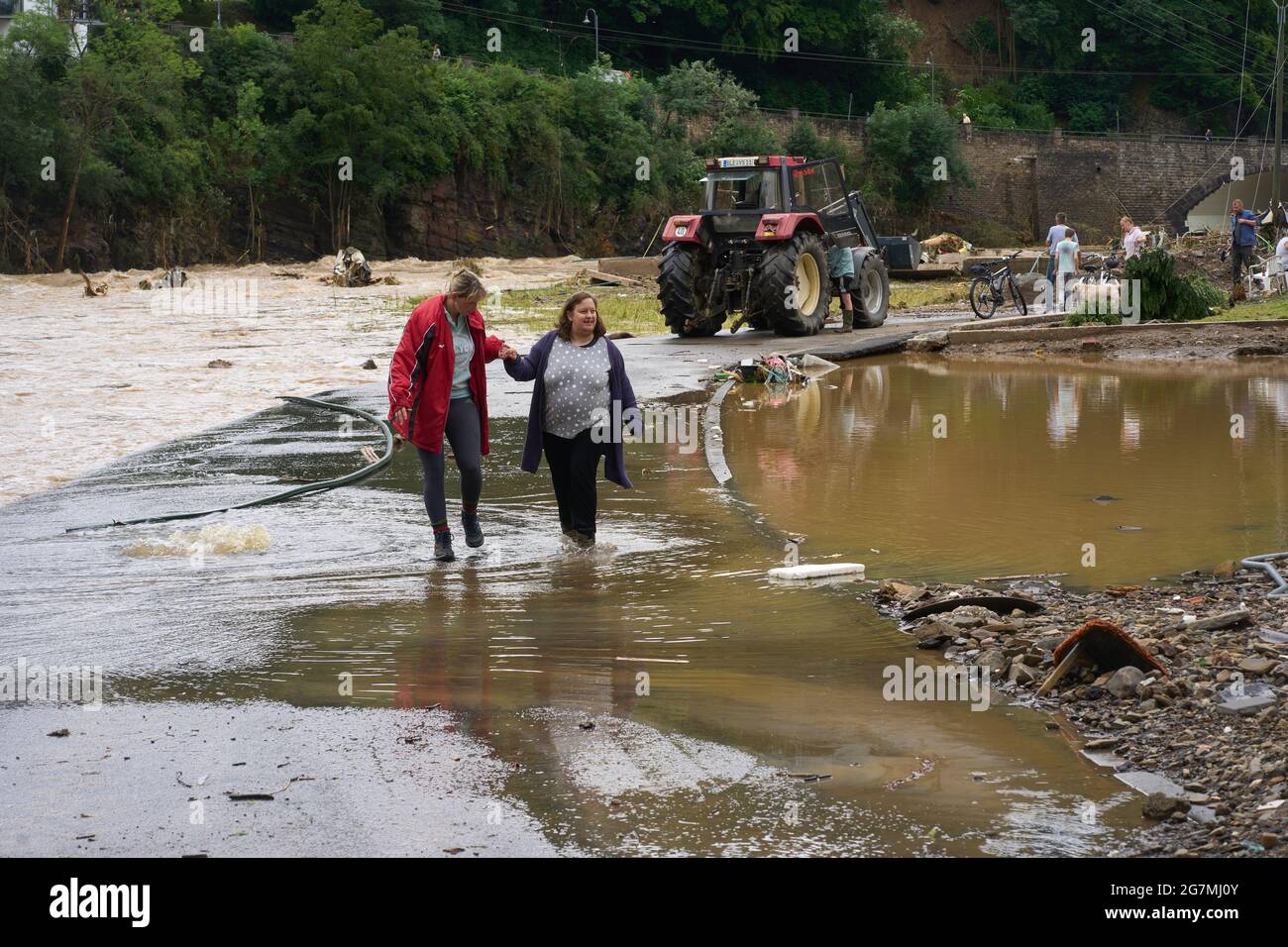 Schuld, Germany. 15th July, 2021. Two women walk through the village in ...