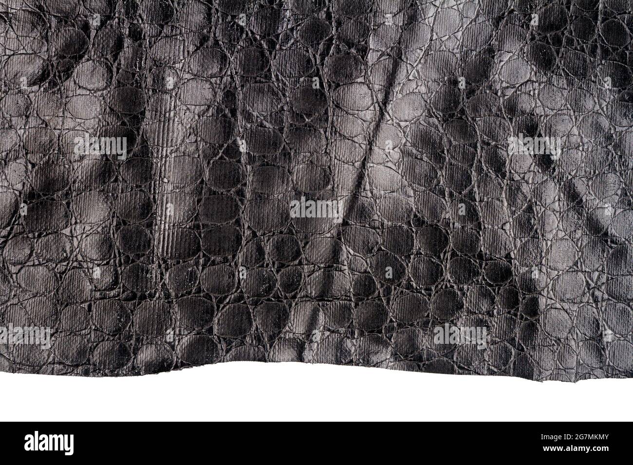 Piece of black artificial leather isolated on white background. Fake ...