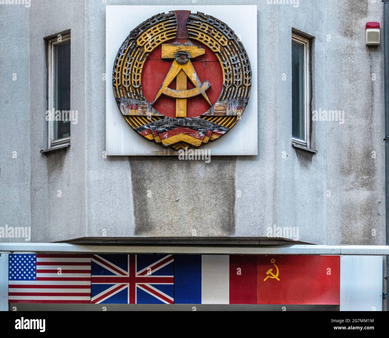 GDR emblem & Allied flags outside Checkpoint Charlie Museum in ...