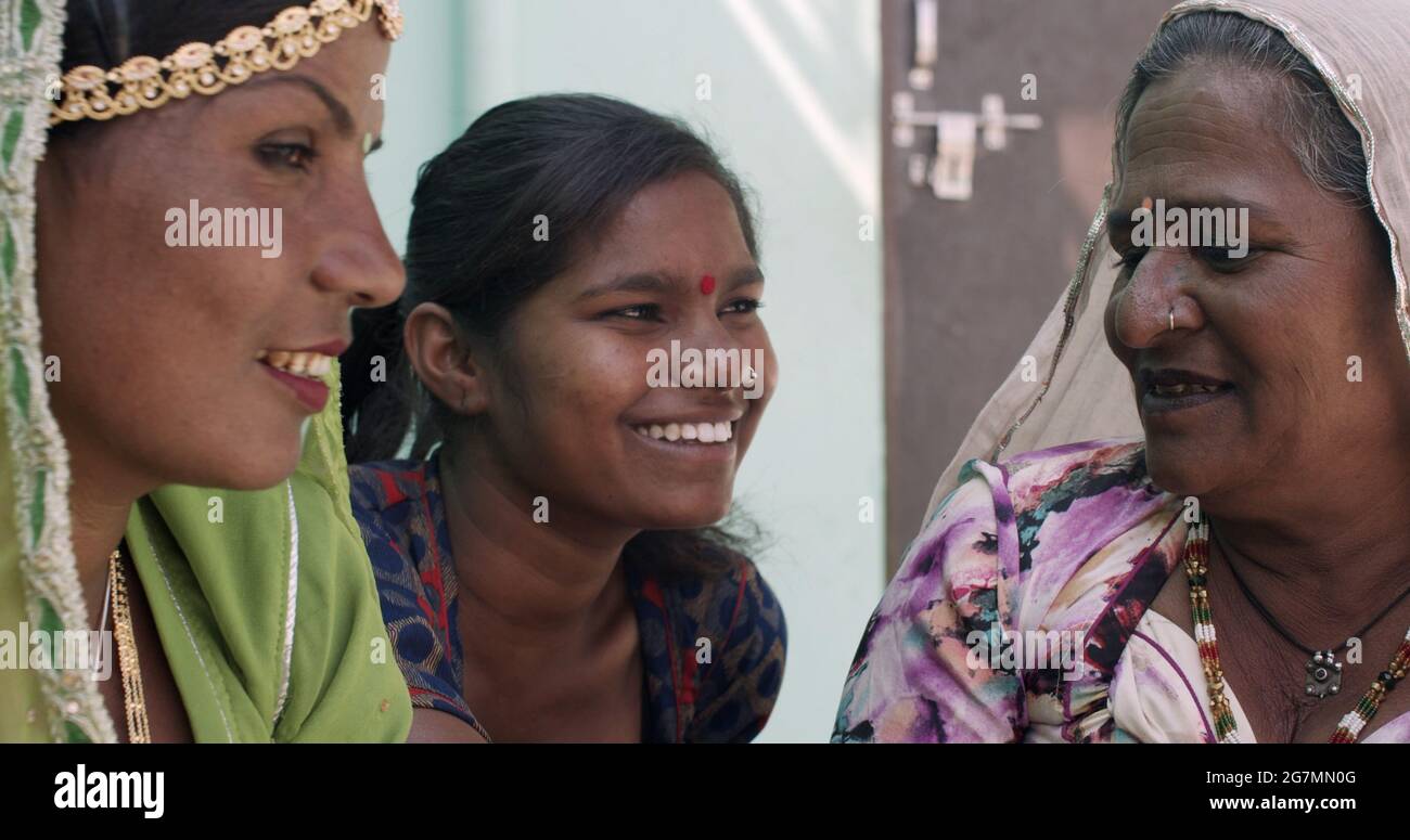 Three indian female adults talking and smiling outdoors Stock Photo - Alamy