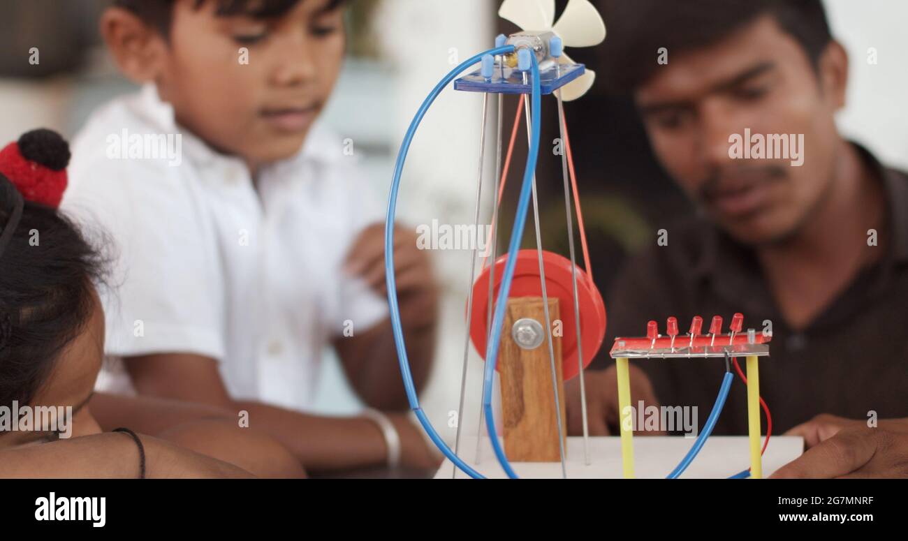 Group of children playing with a constructive toy on a table Stock ...