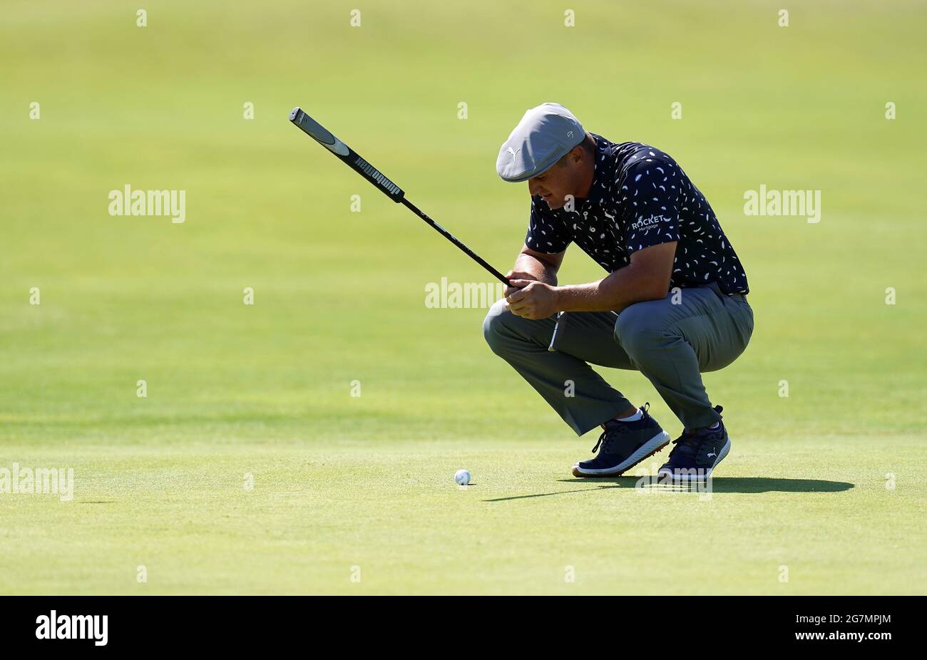 USA's Bryson DeChambeau lines up a putt during day one of The Open at ...