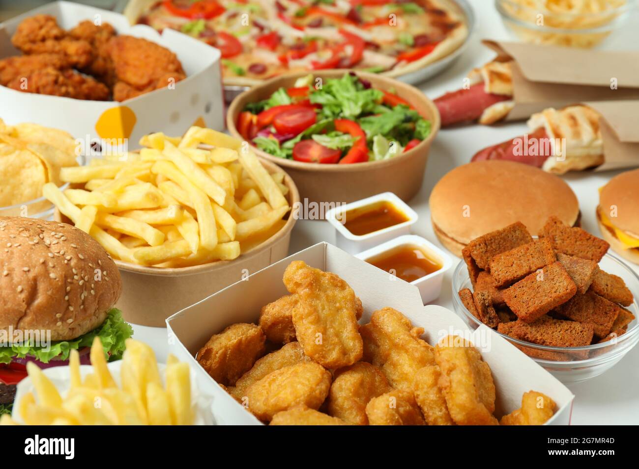 Concept of fast food on white background Stock Photo - Alamy