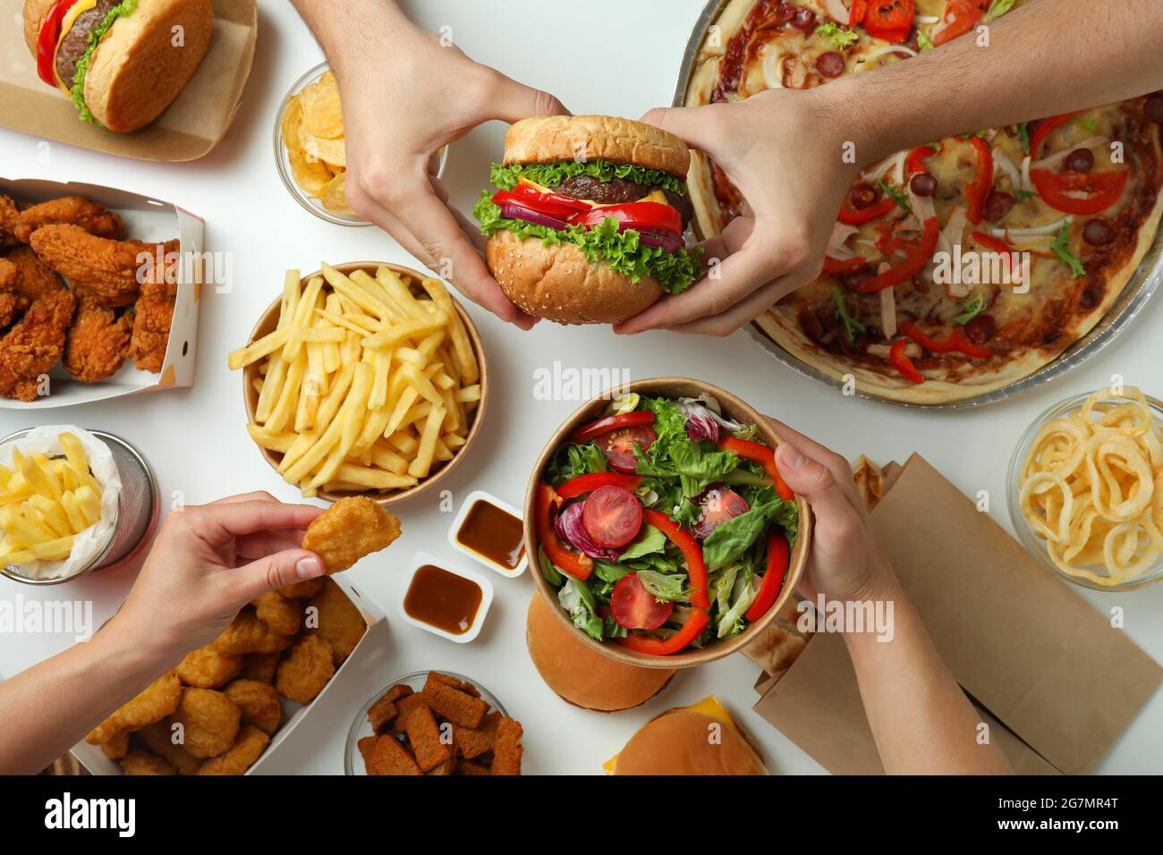 Concept of fast food on white background Stock Photo - Alamy