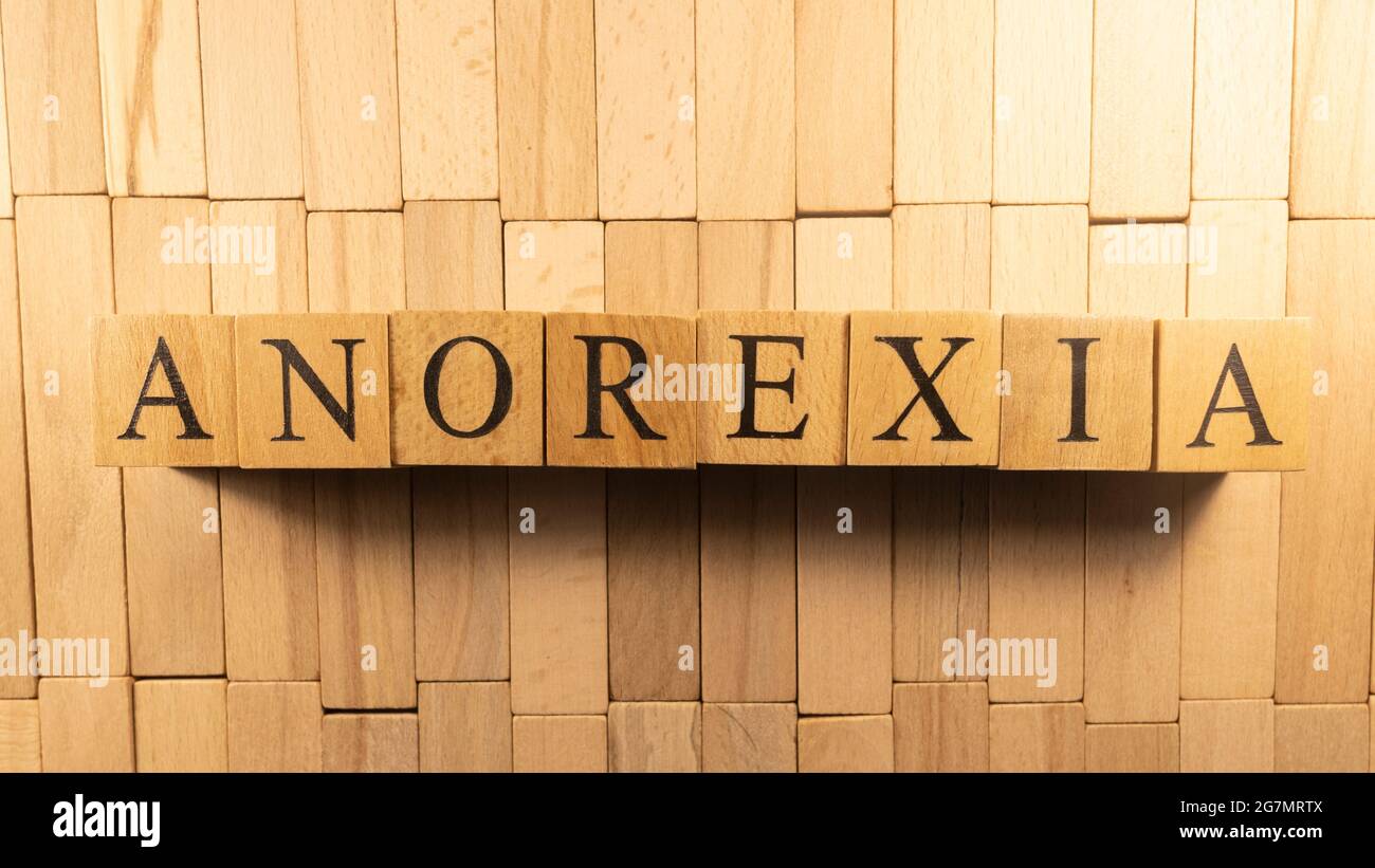 The word anorexia was created from wooden letter cubes. Disease and ...