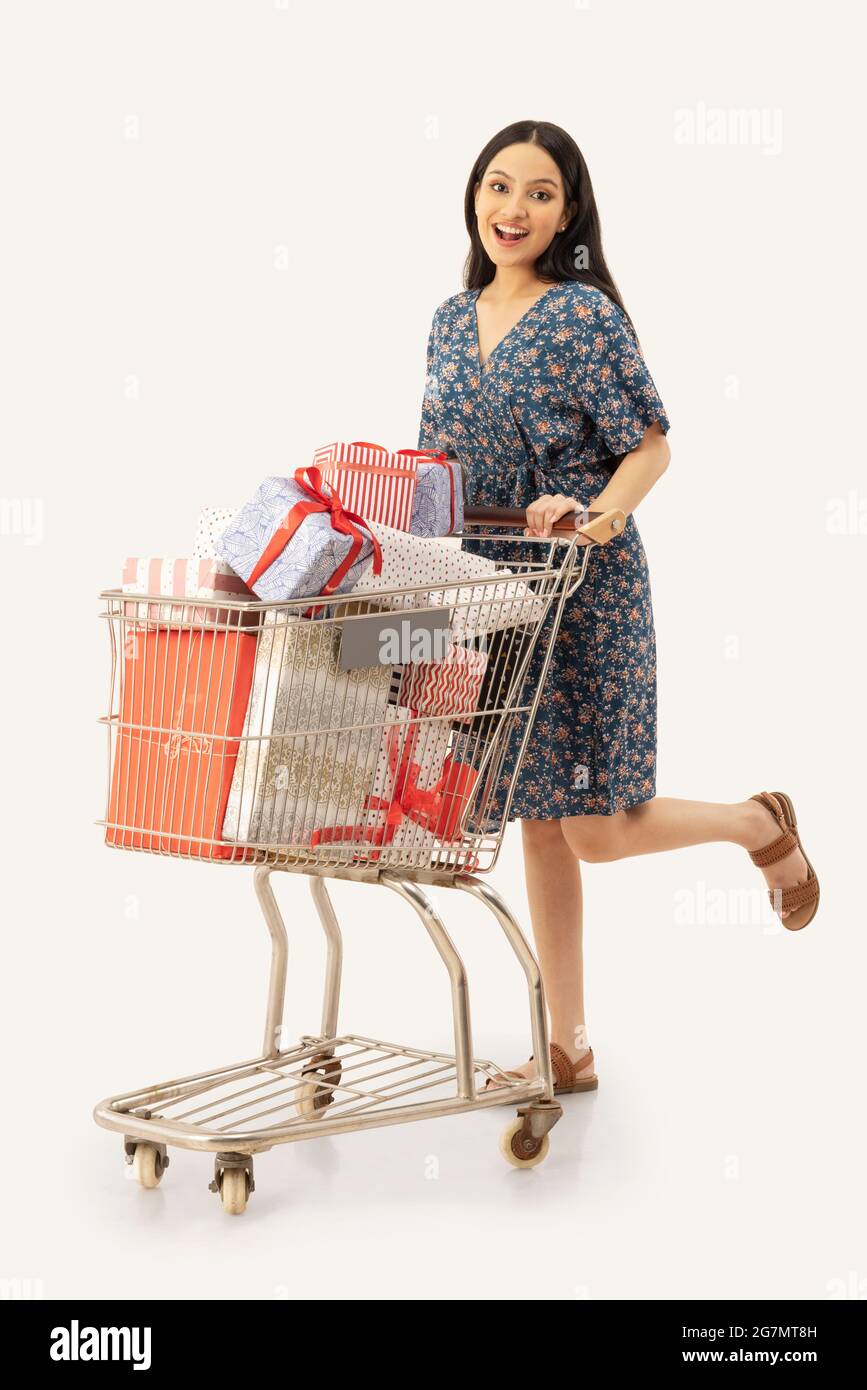 Woman shopping cart full money hi-res stock photography and images - Alamy