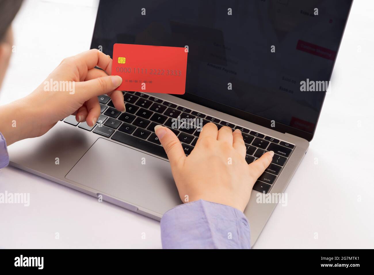 Human hand operating laptop with a card in another hand Stock Photo - Alamy