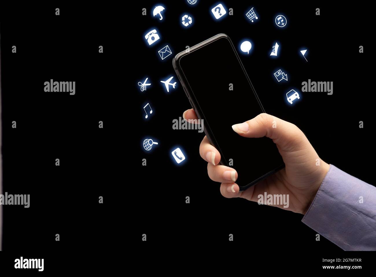 A human hand tapping mobile phone and mobile apps icons flouting around ...