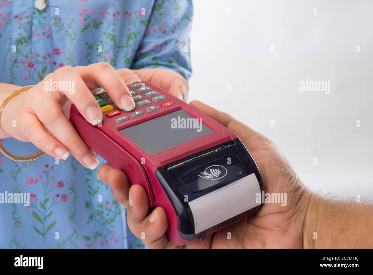 A human hand entering code in swipe machine Stock Photo - Alamy
