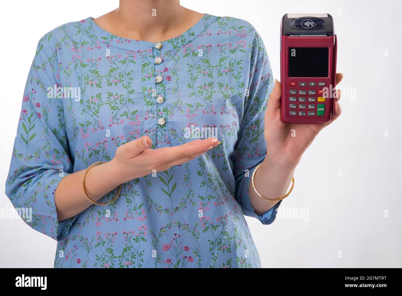 A human hand pointing towards swipe machine Stock Photo - Alamy