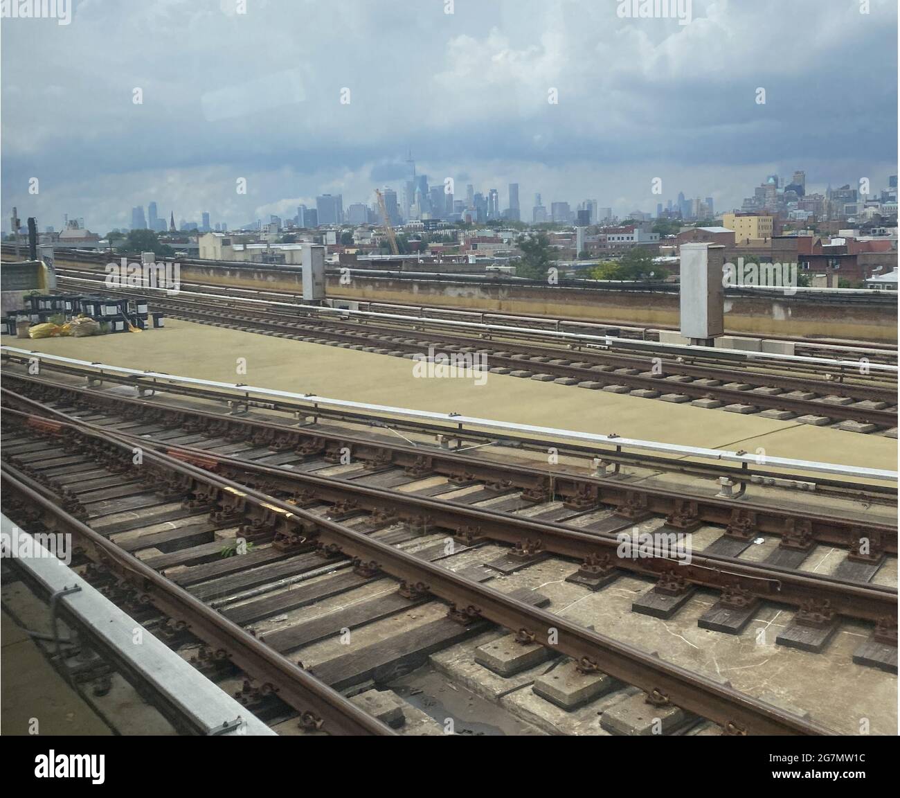 Elevated subway tracks along the F line in Brooklyn with the hazy ...