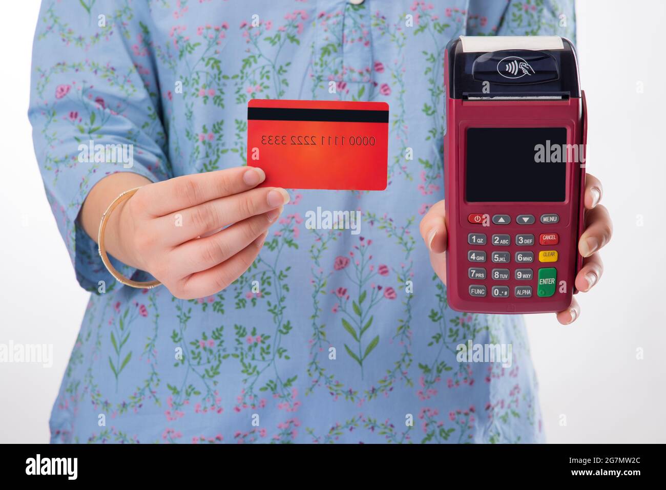 A human hand holding a swipe machine Stock Photo - Alamy