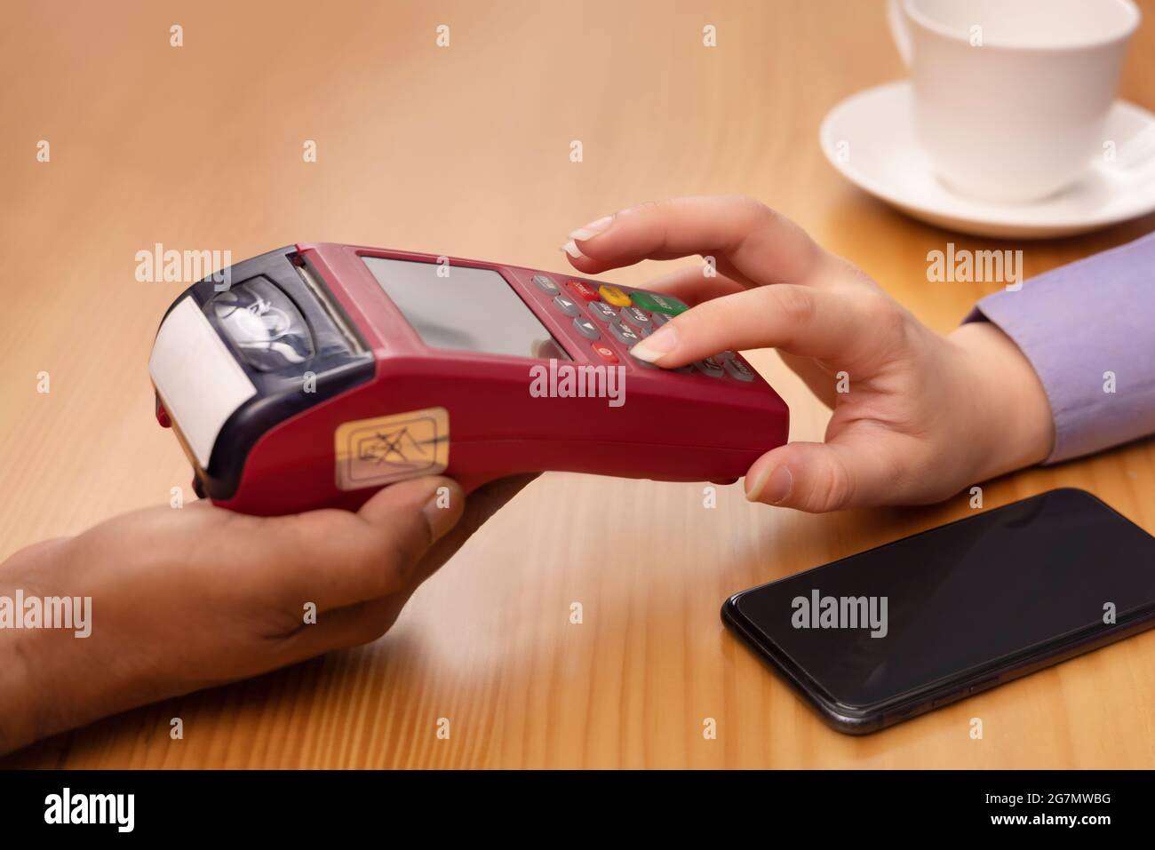 A human hand entering code in swipe machine Stock Photo - Alamy