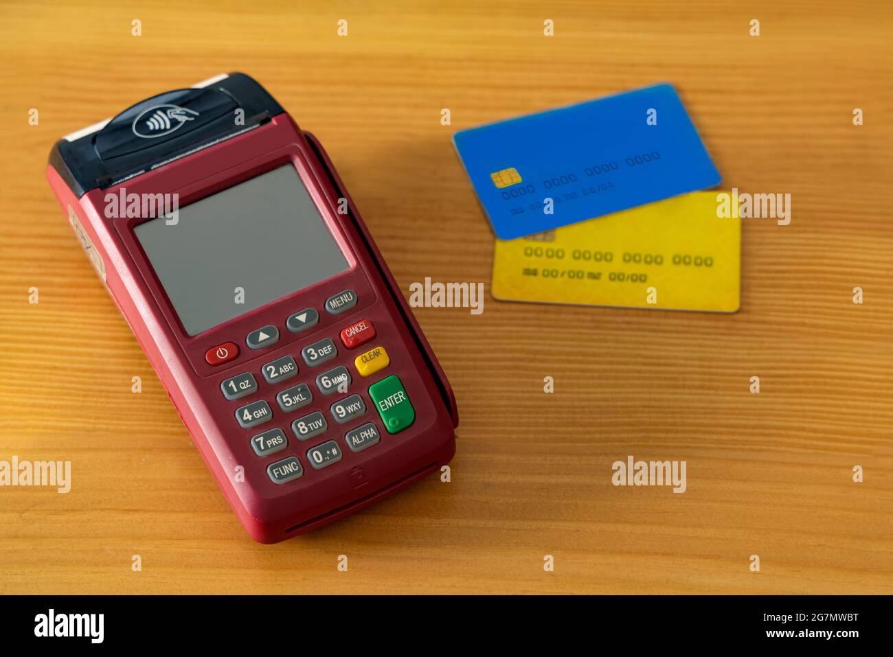A swipe machine kept along with two cards Stock Photo - Alamy
