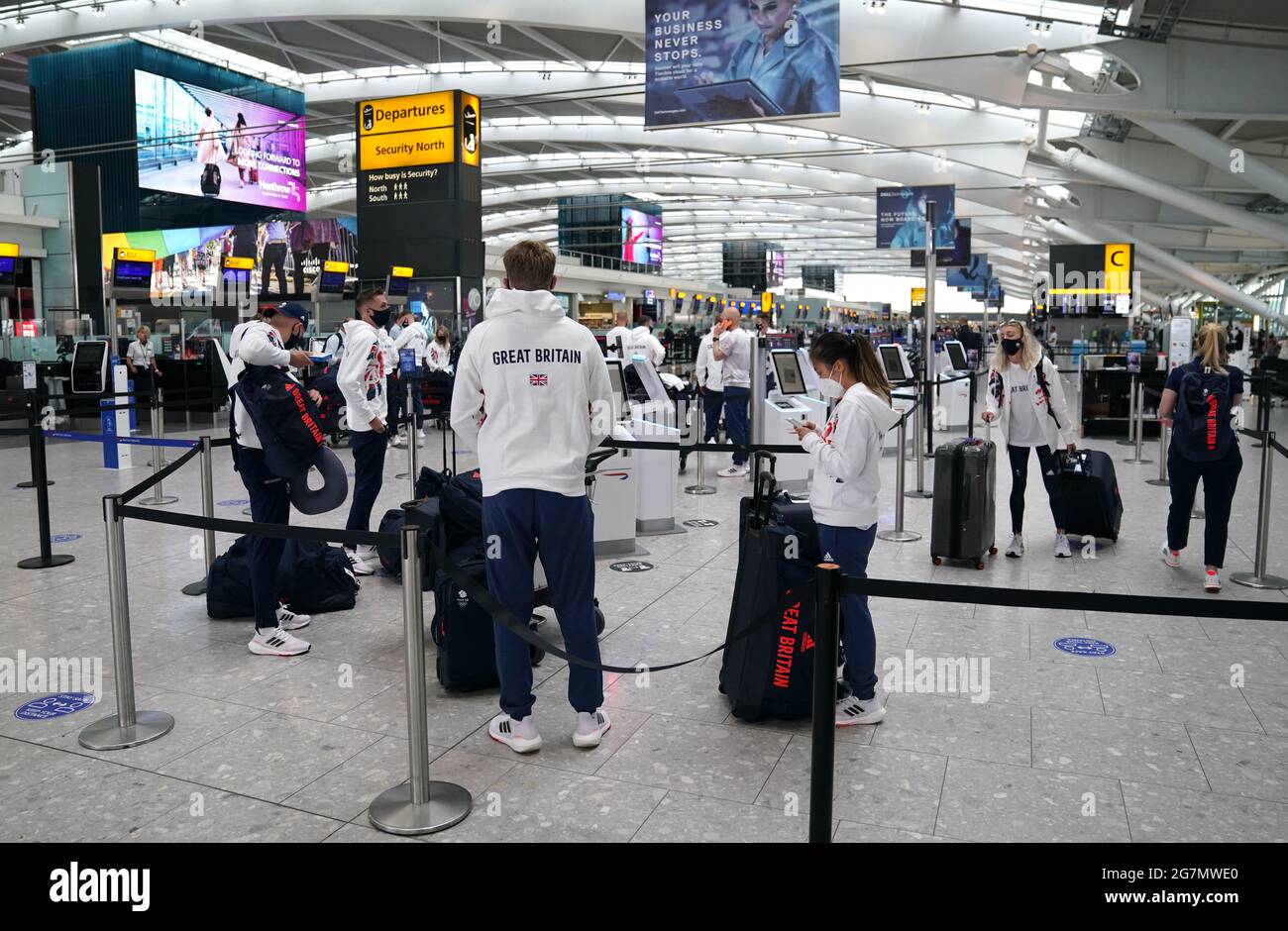 Members of Team GB check in at Heathrow Terminal 5 before they depart ...