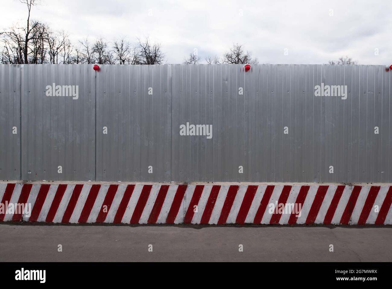 Aluminum fence on concrete blocks. Construction site fencing Stock ...