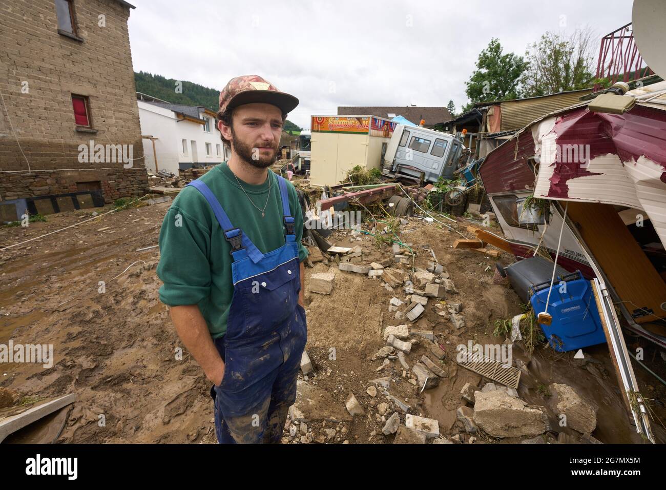 Schuld, Germany. 15th July, 2021. Tim stands in front of the rubble of ...