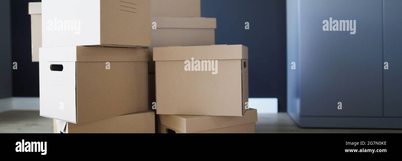 Inside room cardboard boxes on top of each other Stock Photo - Alamy