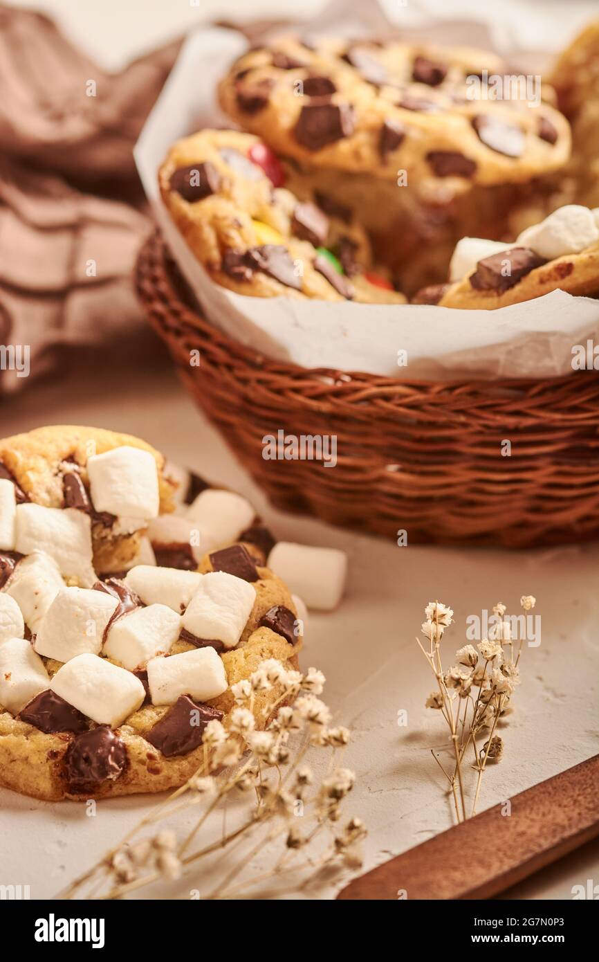 Vertical closeup of chocolate chip cookies with marshmallows. Selected ...