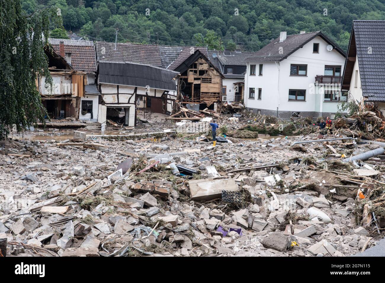 Schuld, Germany. 15th July, 2021. A man stands in the mountains of ...