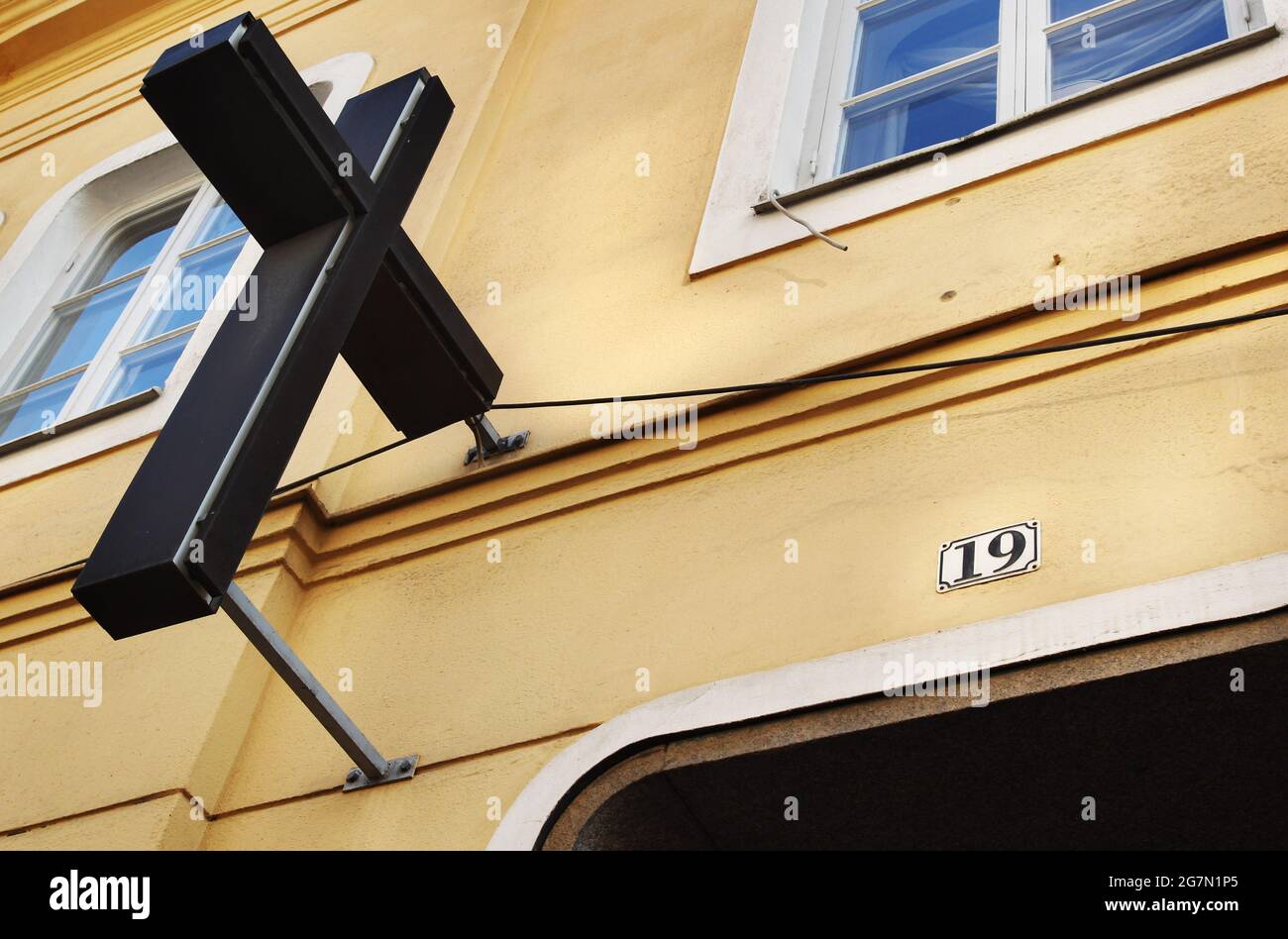 Cross on a facade Stock Photo - Alamy