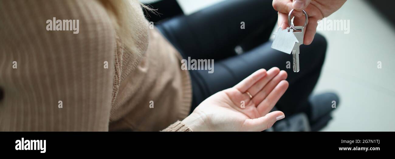 Woman in wheelchair is given keys to house Stock Photo - Alamy