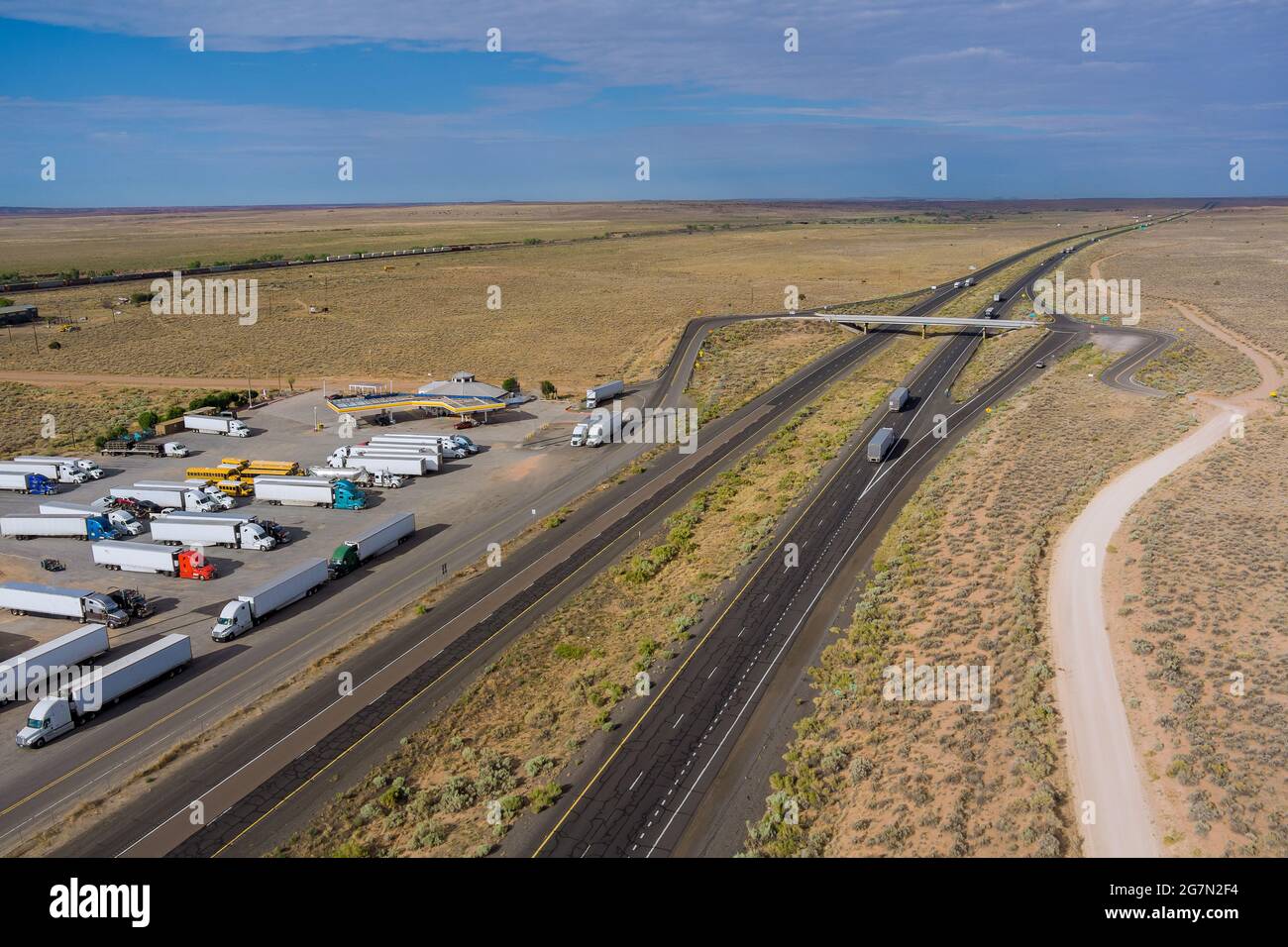 Horizontal panorama trucks stop on rest area near Interstate highway in ...