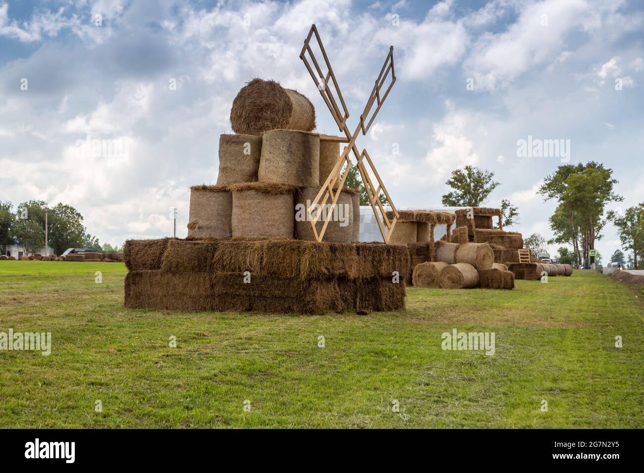 decorative mill from straw bales in the field Stock Photo - Alamy