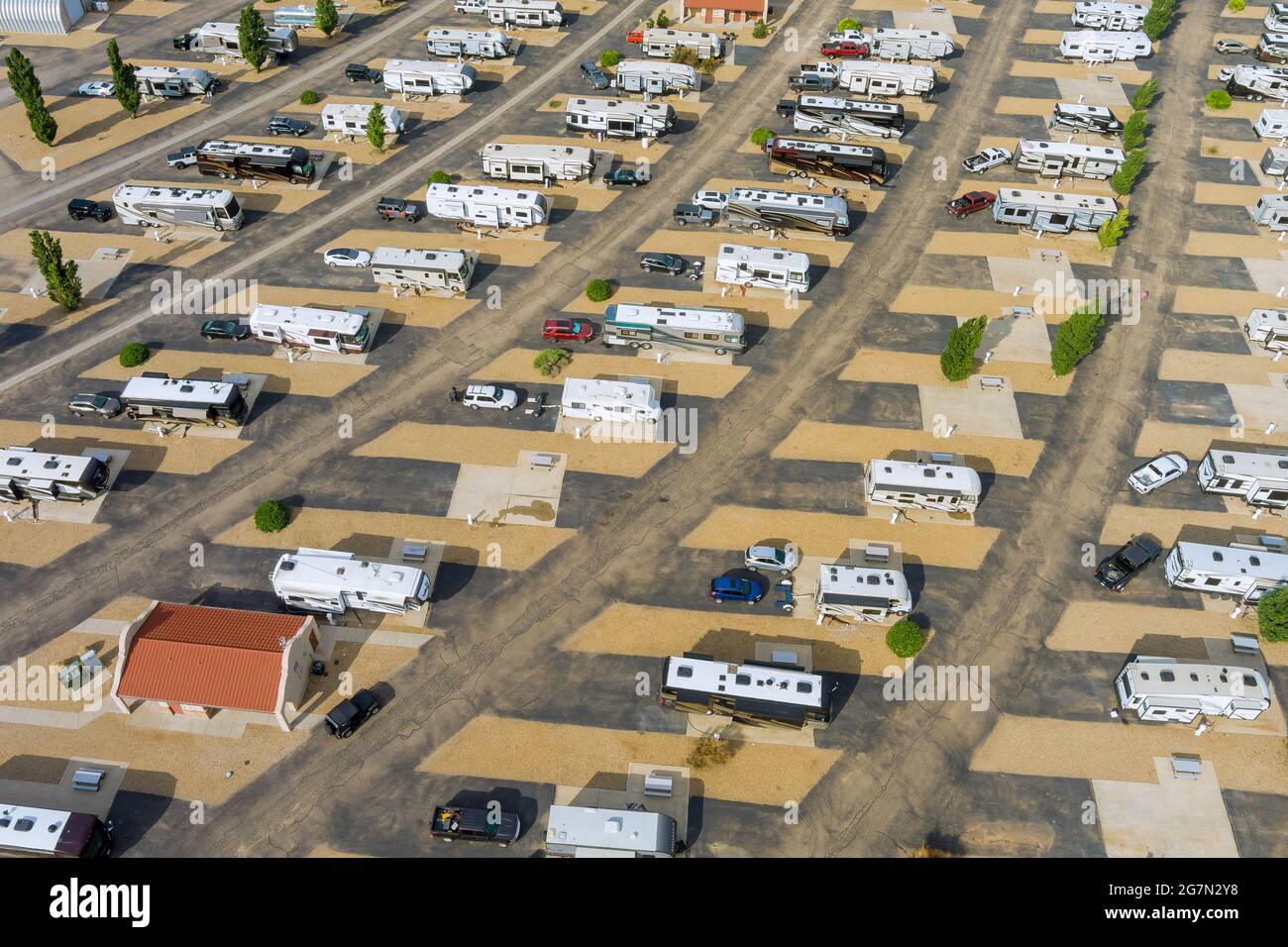 Camping with RV trailer on resort parking camping park Stock Photo - Alamy