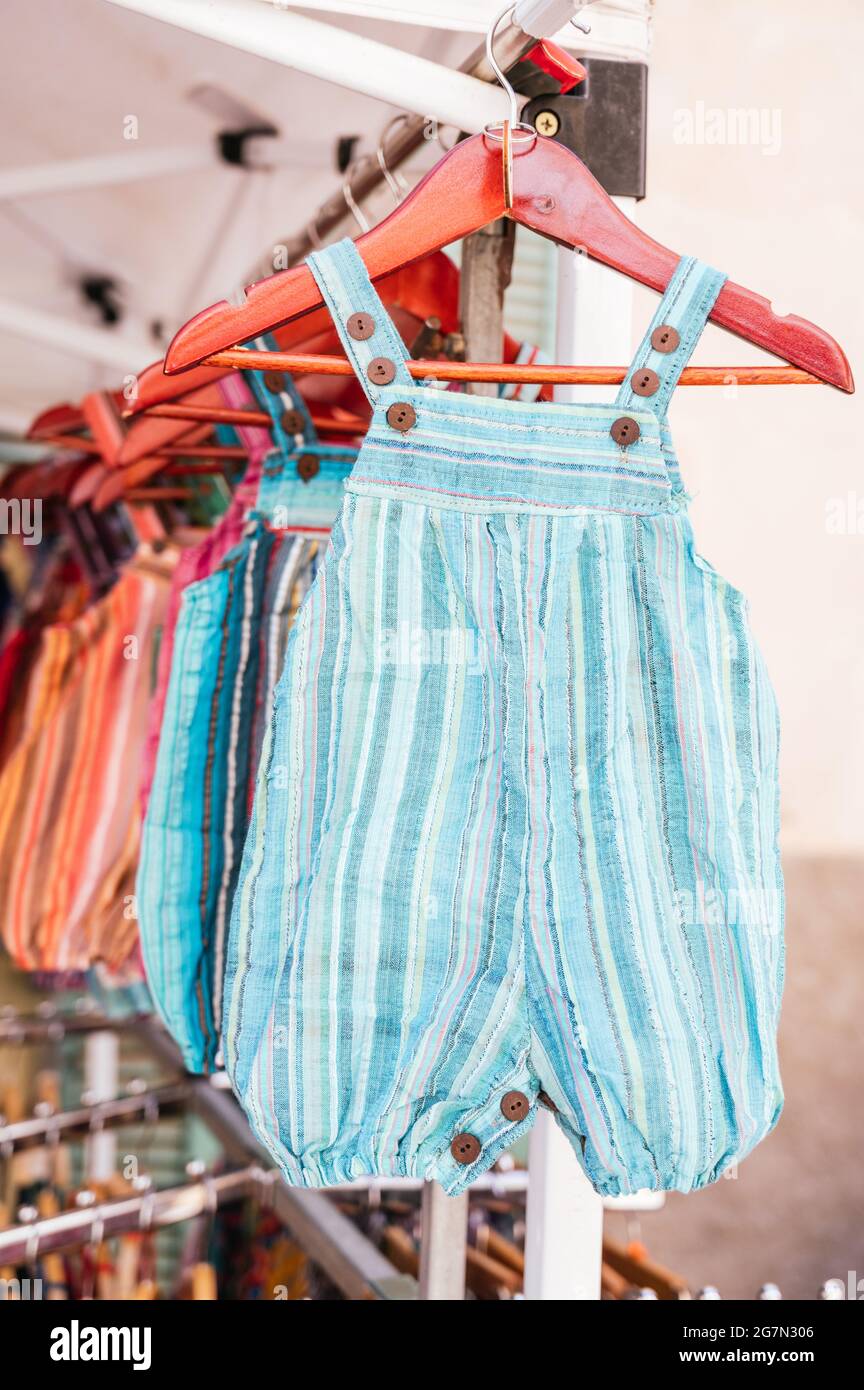 Baby clothing stall hi-res stock photography and images - Alamy