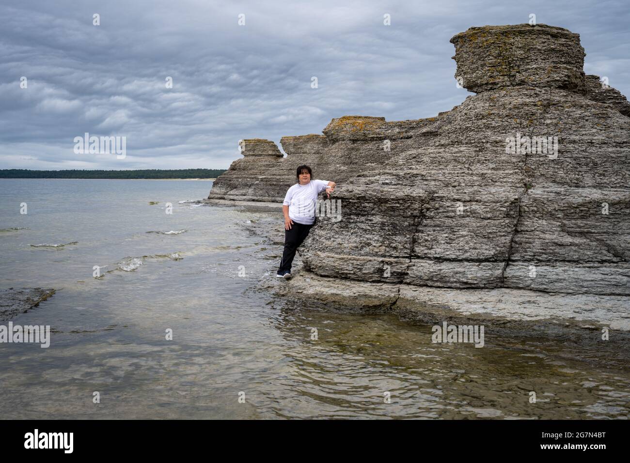 A beautiful limestone formation with a dramatic sky in the background ...