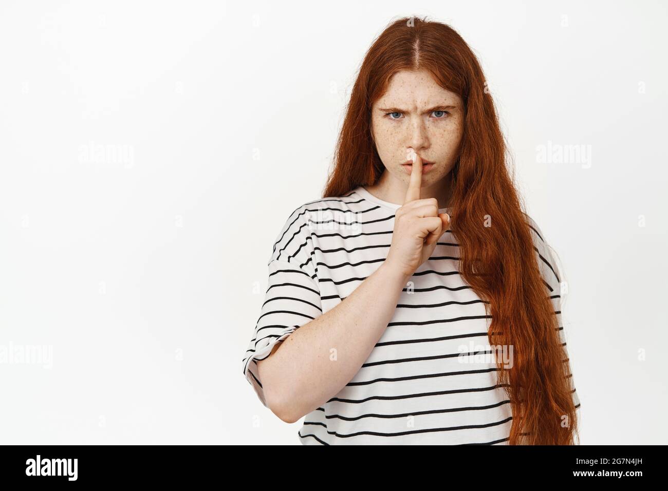 Angry Redhead Teen Girl Hush Frowning Upset And Shushing Tell To Be