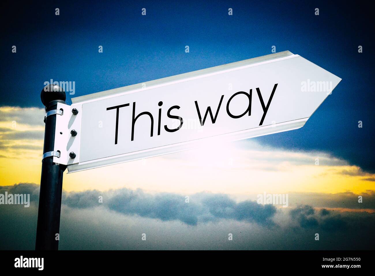 This way - signpost with one arrow, sky in background Stock Photo - Alamy