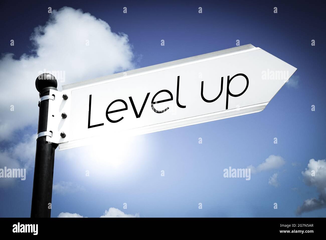 Level up - signpost with one arrow, sky in background Stock Photo - Alamy