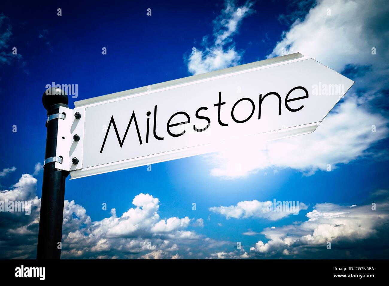 Milestone - signpost with one arrow, sky in background Stock Photo - Alamy